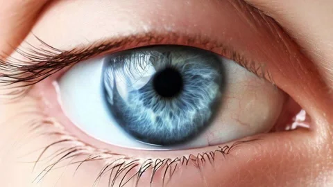 Cinemagraph of blue color eyeball with t... | Stock Video | Pond5