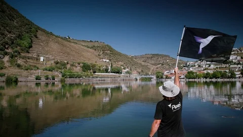 Cinemagraph Loop - Man with Flag, river ... | Stock Video | Pond5
