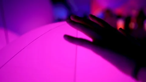 Cinematic Hand Touching Glowing Colorful... | Stock Video | Pond5