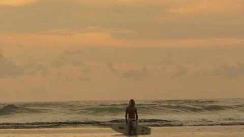 Cinematic shot man surfer is standing up... | Stock Video | Pond5