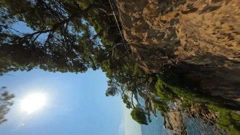 Cinematic vertical fpv shot along the co... | Stock Video | Pond5