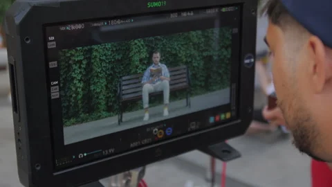 Cinematographer checks actor playing on ... | Stock Video | Pond5