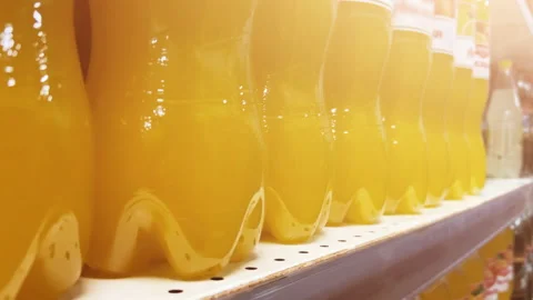 Citrus lemonade in plastic bottles is on... | Stock Video | Pond5