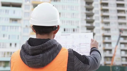Civil engineer looking drawing of a tall... | Stock Video | Pond5
