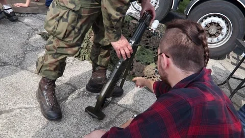 A civilian looking at the LMP-2017 Light... | Stock Video | Pond5