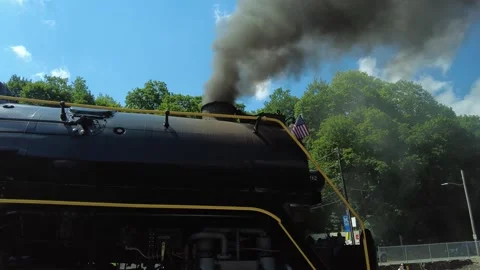 A classic steam locomotive puffs out bla... | Stock Video | Pond5