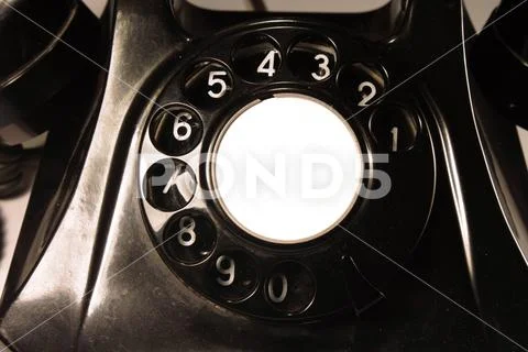 Classical dial of an old bakelite telephone. Isolated on white ...