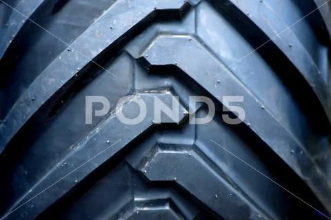 Clean, new tractor wheel tread, pattern, wallpaper Stock Photo #116913000