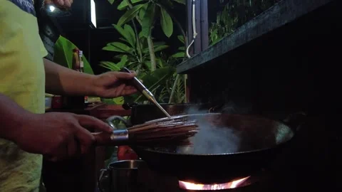 Clean the pan to prepare the following d... | Stock Video | Pond5