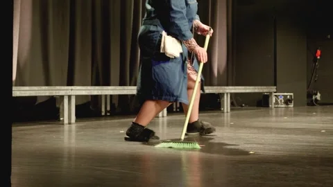 The cleaner sweeps the theater stage wit... | Stock Video | Pond5