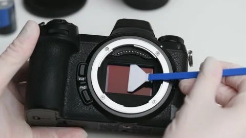 Cleaning the camera sensor with sensor c... | Stock Video | Pond5