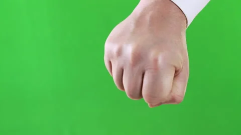Clenched fist pointing downward. Close u... | Stock Video | Pond5