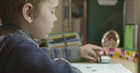 Clever Child Boy Learn Reading Book at D... | Stock Video | Pond5