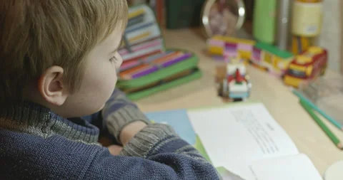 Clever Child Boy Learn Reading Book at D... | Stock Video | Pond5