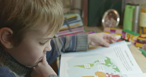 Clever Child Boy Learn Reading Book at D... | Stock Video | Pond5