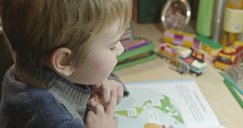 Clever Child Boy Learn Reading Book at D... | Stock Video | Pond5