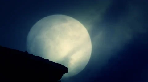 A Cliff at Night on a Rising Full Moon B... | Stock Video | Pond5