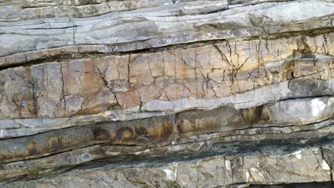 Cliff - rugged dipping sedimentary rock ... | Stock Video | Pond5