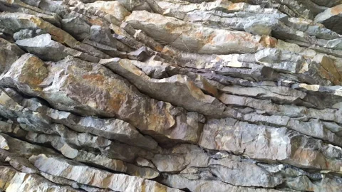 Cliff - rugged dipping sedimentary rock ... | Stock Video | Pond5