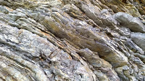 Cliff - rugged dipping sedimentary rock ... | Stock Video | Pond5