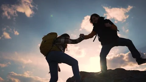Climbers team up to conquer the mountain... | Stock Video | Pond5