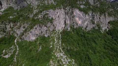 Climbing mountain slope with steep cliff... | Stock Video | Pond5