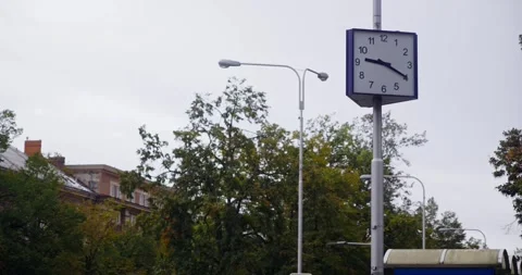 Clock above public bus stop in the urban... | Stock Video | Pond5