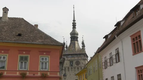 Clock Tower seen behind buildings | Stock Video | Pond5