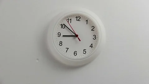 Clock on wall ticking showing nine hour... | Stock Video | Pond5
