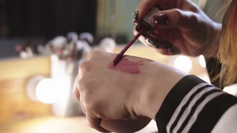 Close-up of actresss hand testing lipsti... | Stock Video | Pond5