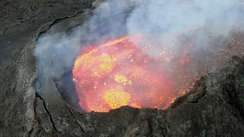 Close-up aerial view of erupting volcano... | Stock Video | Pond5