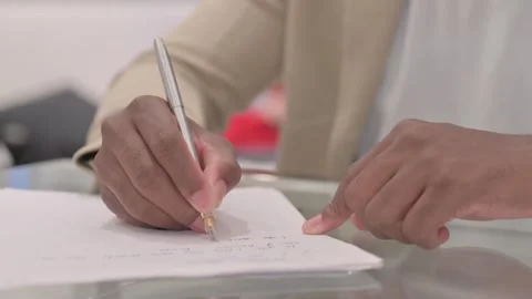 Close up of African Male Hand Writing a ... | Stock Video | Pond5