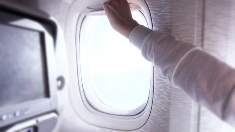 Close airplane window inside plane inter... | Stock Video | Pond5