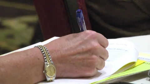 close up arm and hand woman taking notes | Stock Video | Pond5