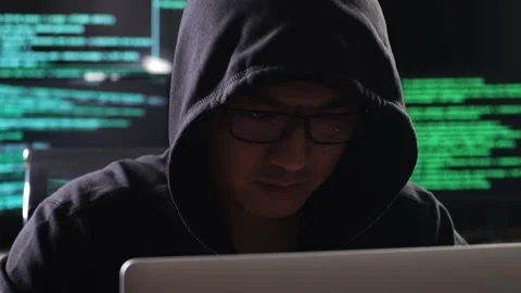 Close Up Of Asian Male Hacker In A Hood ... | Stock Video | Pond5