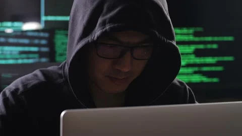 Close Up Of Asian Male Hacker In A Hood ... | Stock Video | Pond5