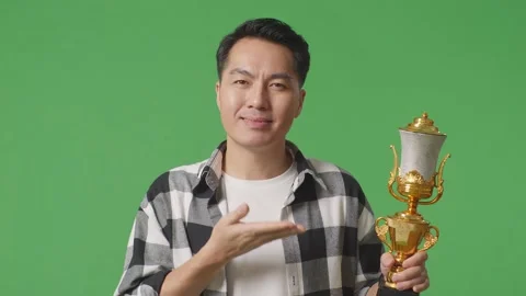 Close Up Of Asian Man Pointing To A Gold... | Stock Video | Pond5