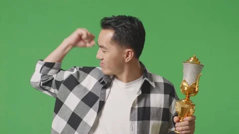 Close Up Of Asian Man With Trophy Flexin... | Stock Video | Pond5