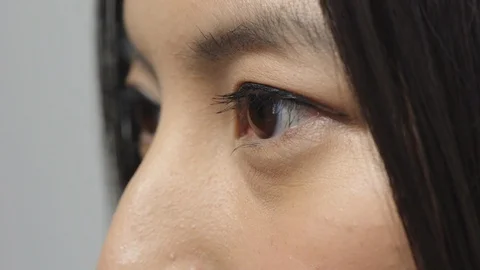 close up asian woman eyes smiling cheerf... | Stock Video | Pond5