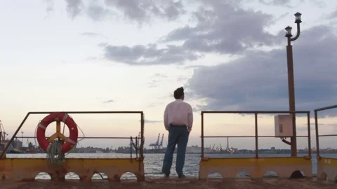 The close-up back view of the man standi... | Stock Video | Pond5