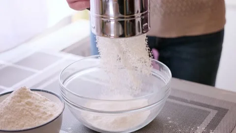 Close-up of bakery concept - Woman sift ... | Stock Video | Pond5