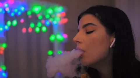 Close-up of beauty girl inhaling an e-ci... | Stock Video | Pond5
