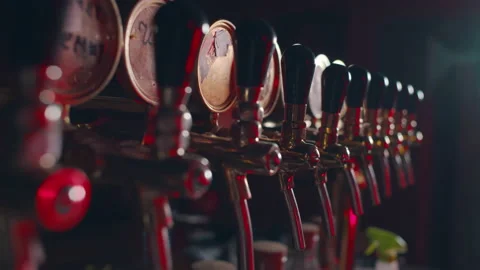 Close up of beer taps in bar. Different ... | Stock Video | Pond5