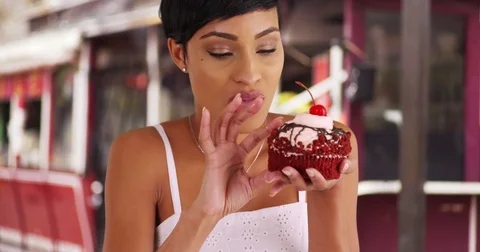 Close up of black female eating big red ... | Stock Video | Pond5