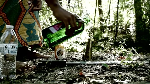 Close up of a Black woman pouring libati... | Stock Video | Pond5
