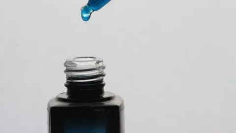 Close-up of blue oil drops falling from ... | Stock Video | Pond5