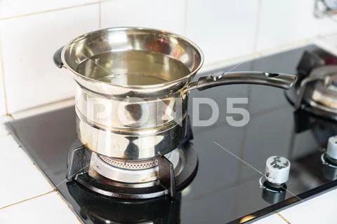 Close up boiling water in pot on gas stove. ~ Hi Res #202414563
