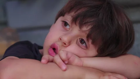 Close-up of bored child drooling and gaz... | Stock Video | Pond5