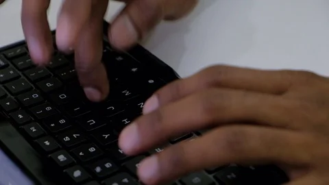 Close up of brown Indian hands typing on... | Stock Video | Pond5