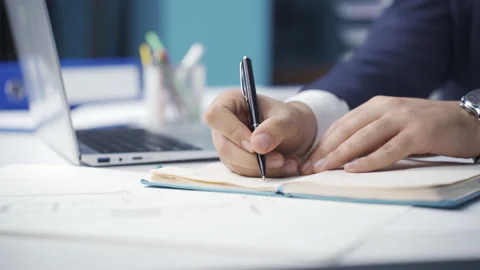 Close-up businessman taking notes, writi... | Stock Video | Pond5